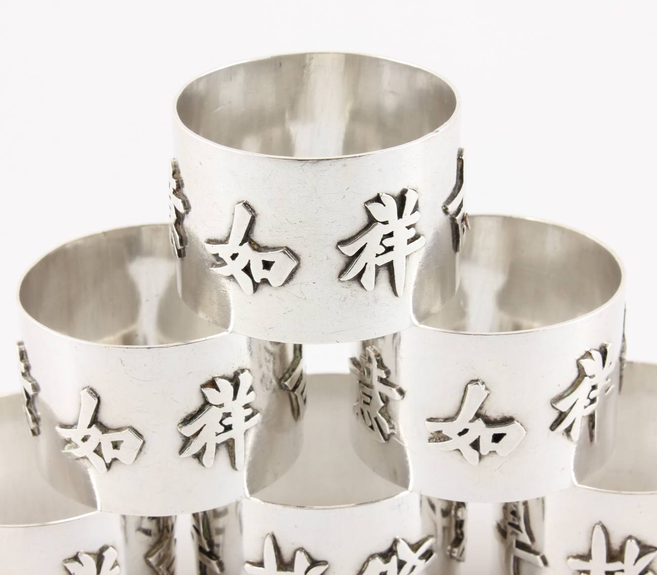 Six Chinese Silver Napkin Rings With Chinese Symbols. Wang Hing c1890.