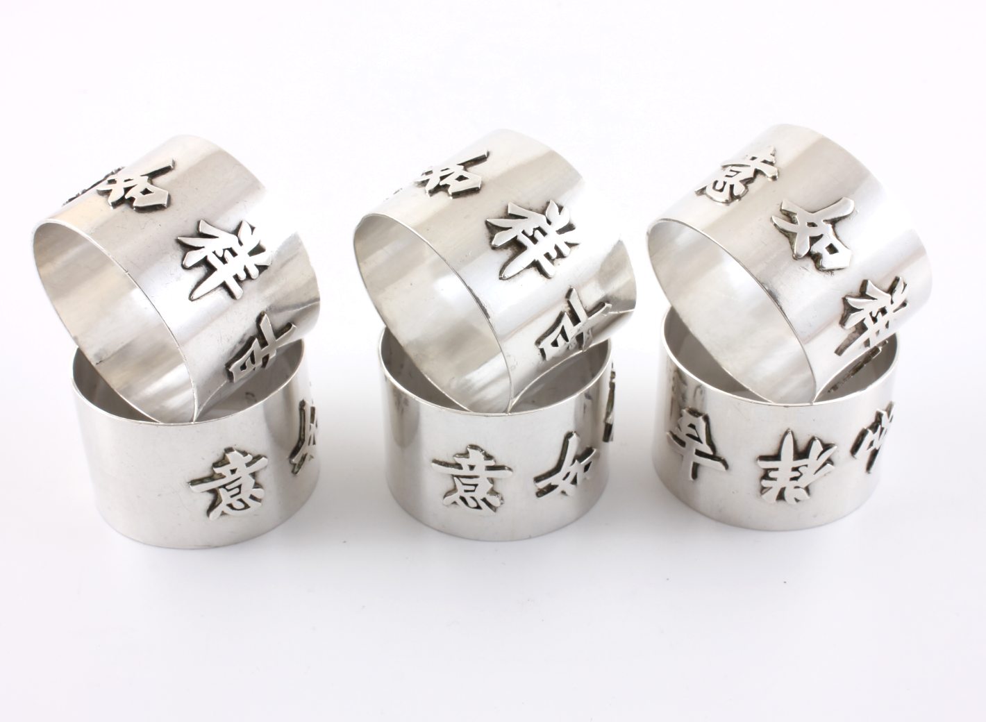 Six Chinese Silver Napkin Rings With Chinese Symbols. Wang Hing c1890.
